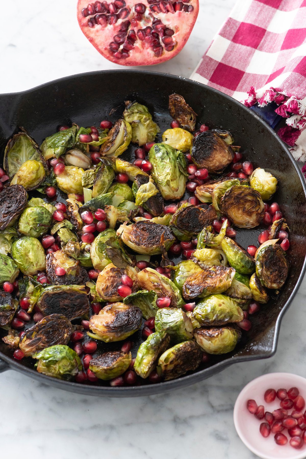 Cast Iron Brussels Sprouts with Pomegranate and Garlic - Weelicious